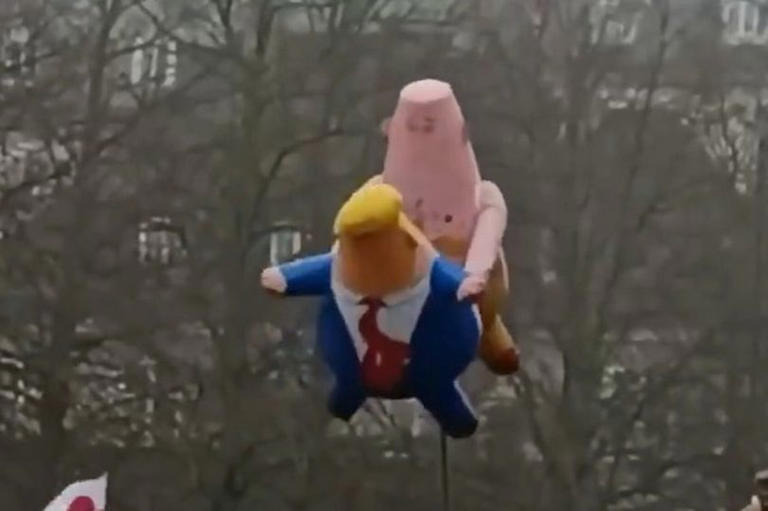 Trump trolled by protesters who portray him and Putin in energetic love act