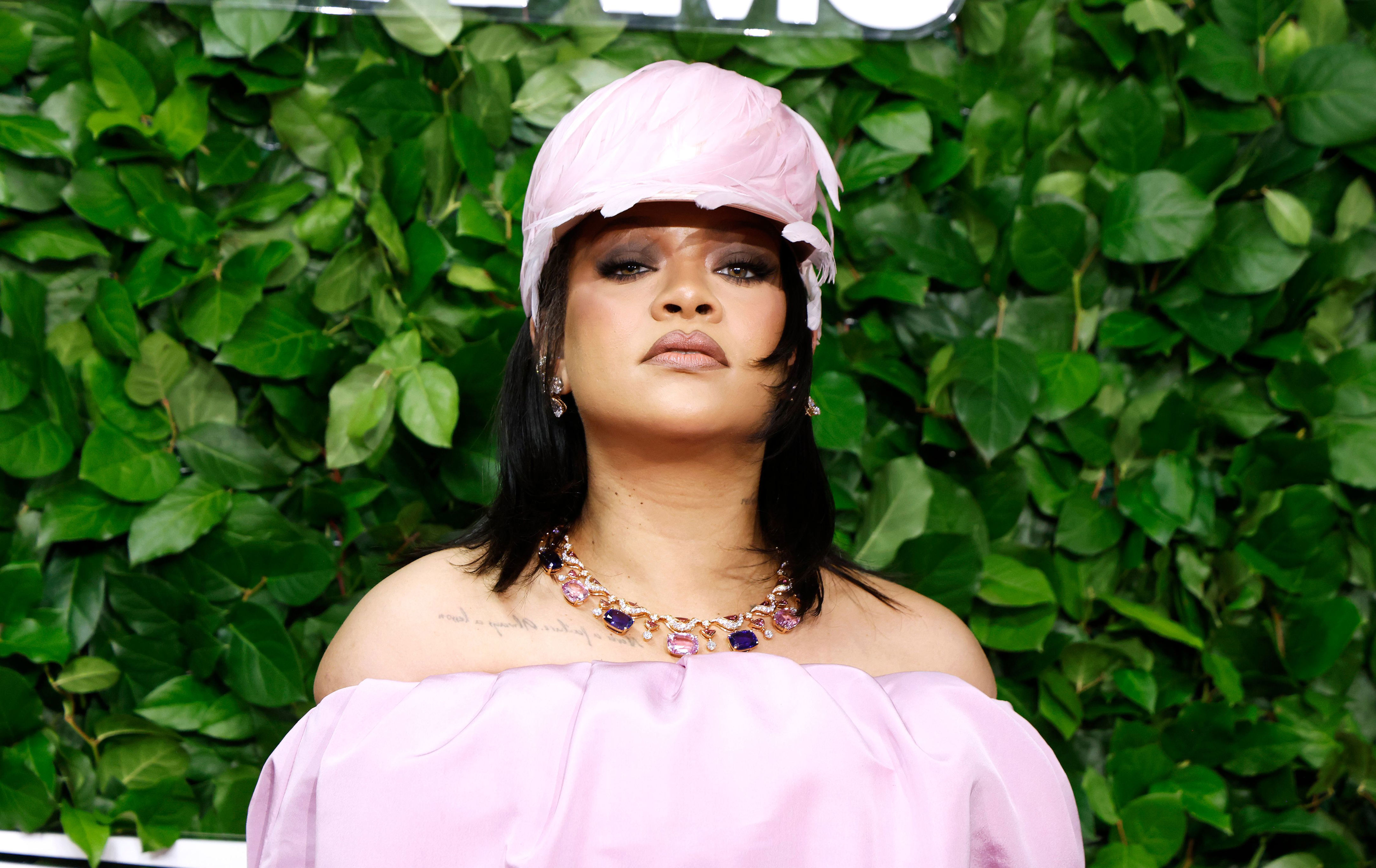 Rihanna's top knot and red lip are making me nostalgic for 2012