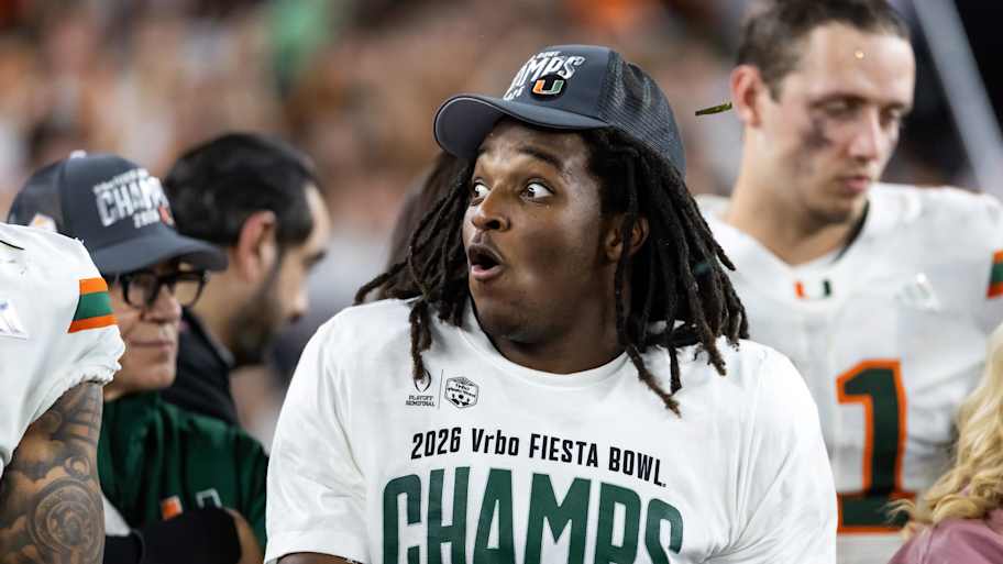 Photo of Ed Reed and his big hat consoling Miami’s Malachi Toney loved ...