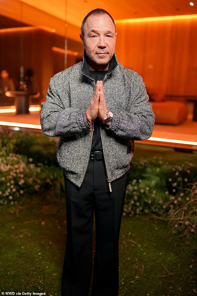 Pharrell Williams is supported by his wife Helen and their four ...