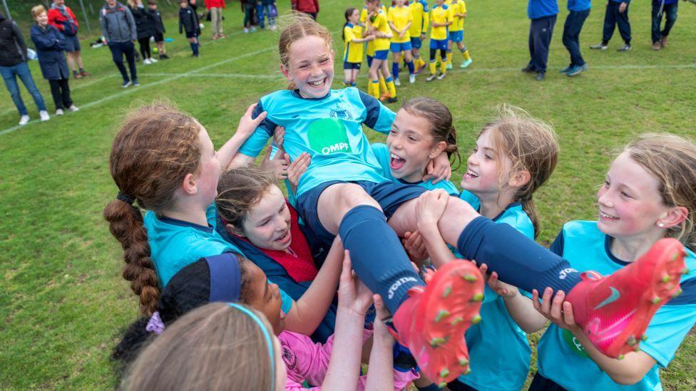 Are we not good enough? Girls football team win tiny plastic cup as ...