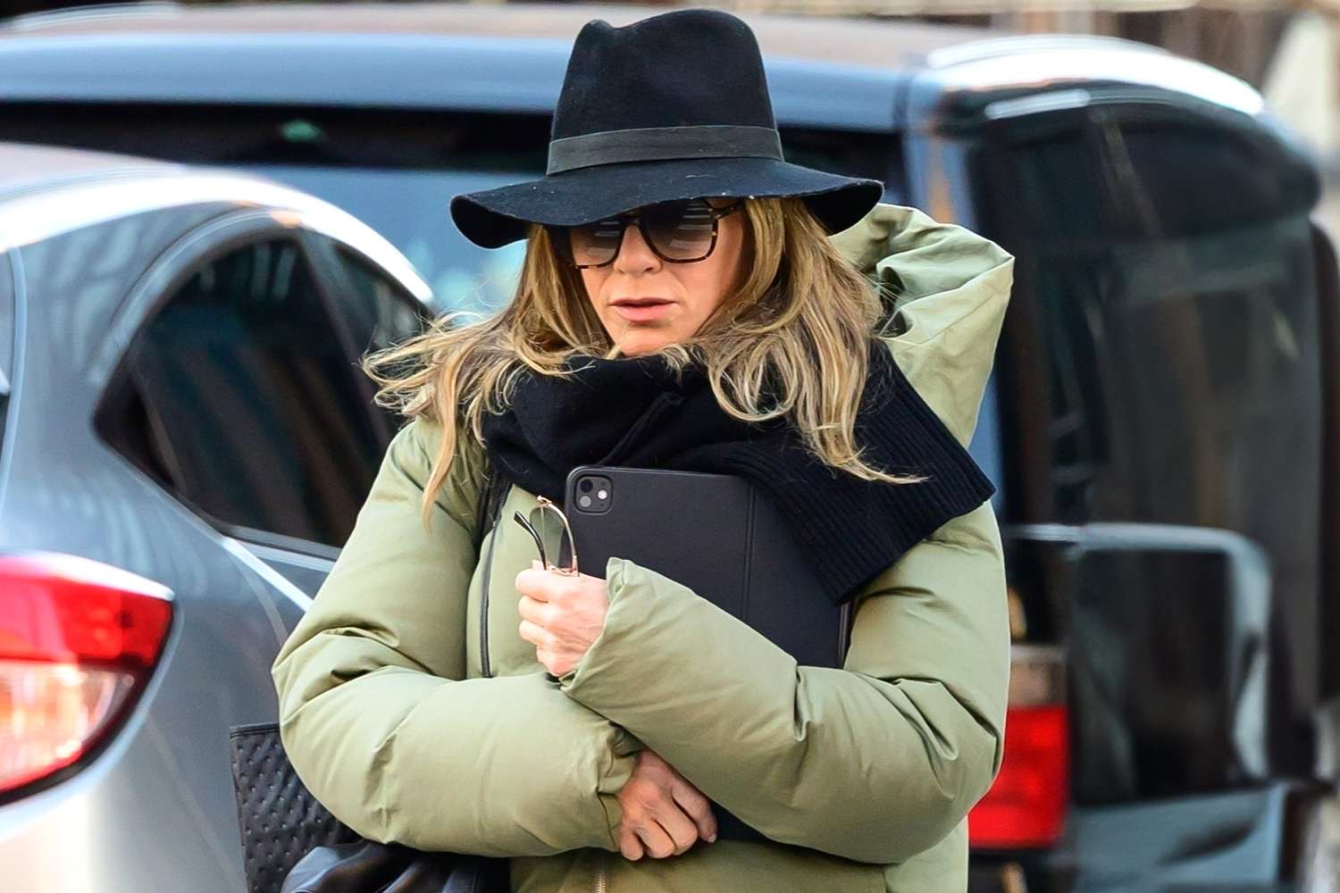 Jennifer Aniston braved the cold in a snuggly puffer jacket paired with ...