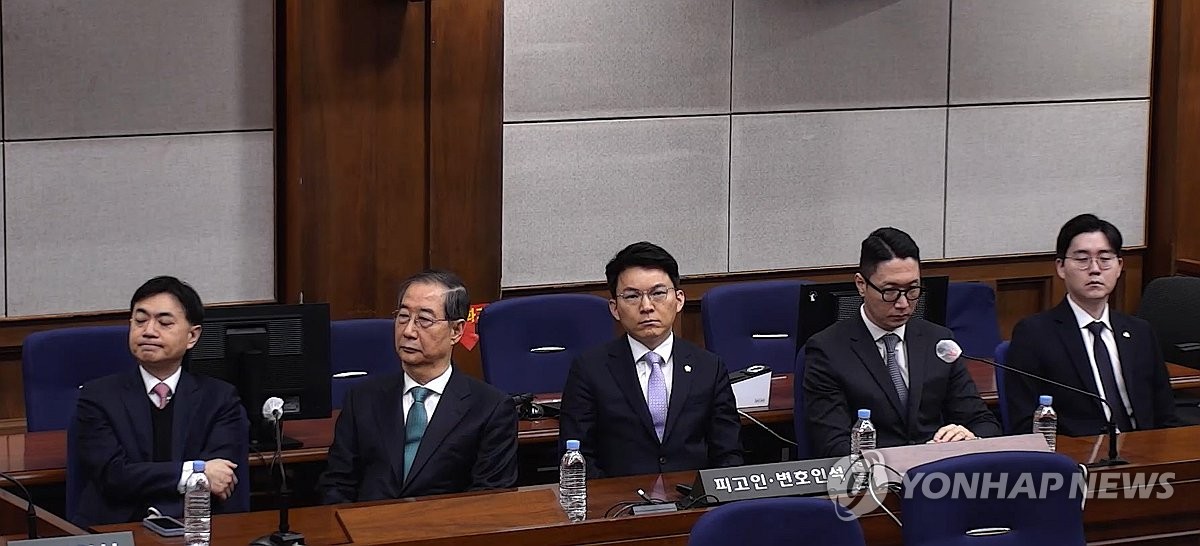 Ex-PM Han sentenced to 23 yrs in prison