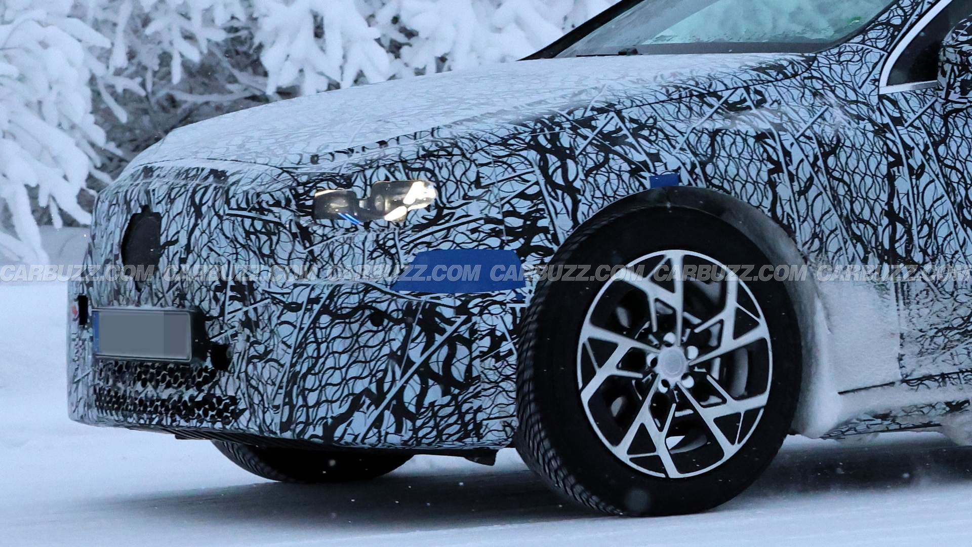 Mercedes-Benz C-Class EV prototype spied in the snow with a strange grille