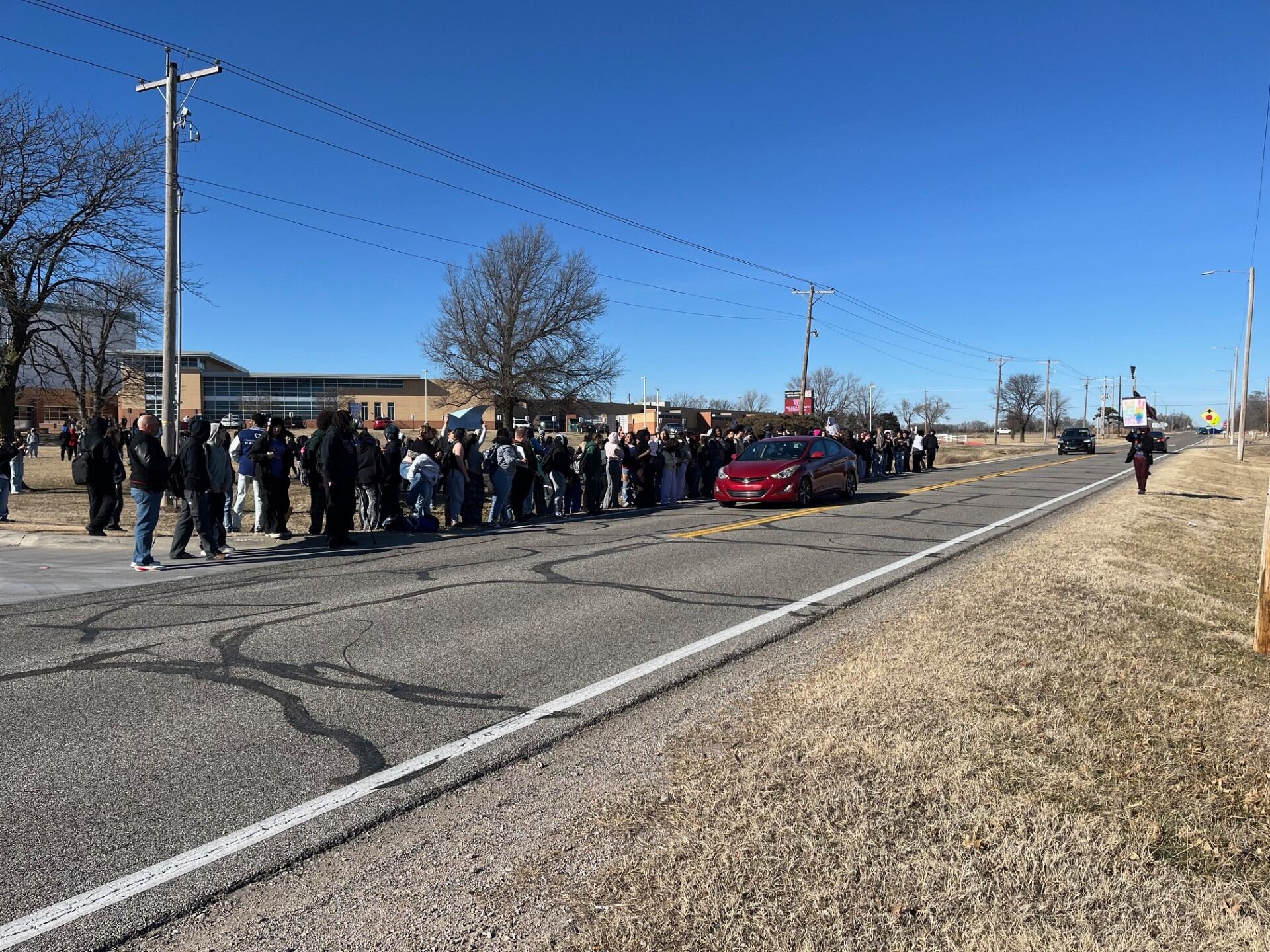 Wichita high school students walk out, voice opposition to ramped up ...