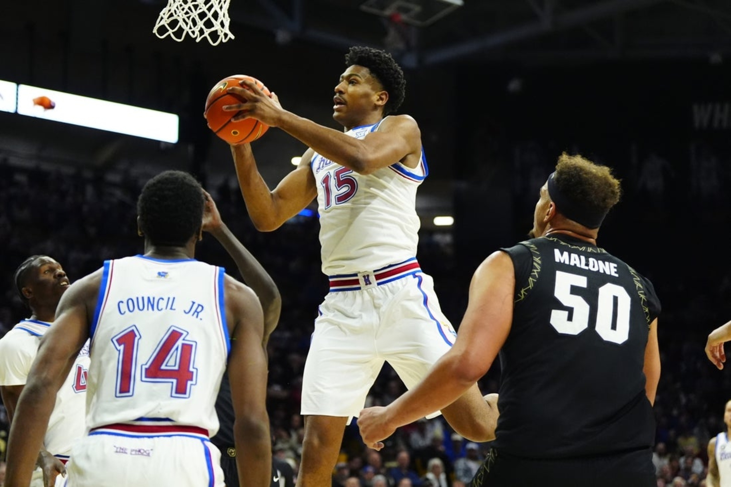 Without Bill Self, No. 19 Kansas hangs on to beat Colorado