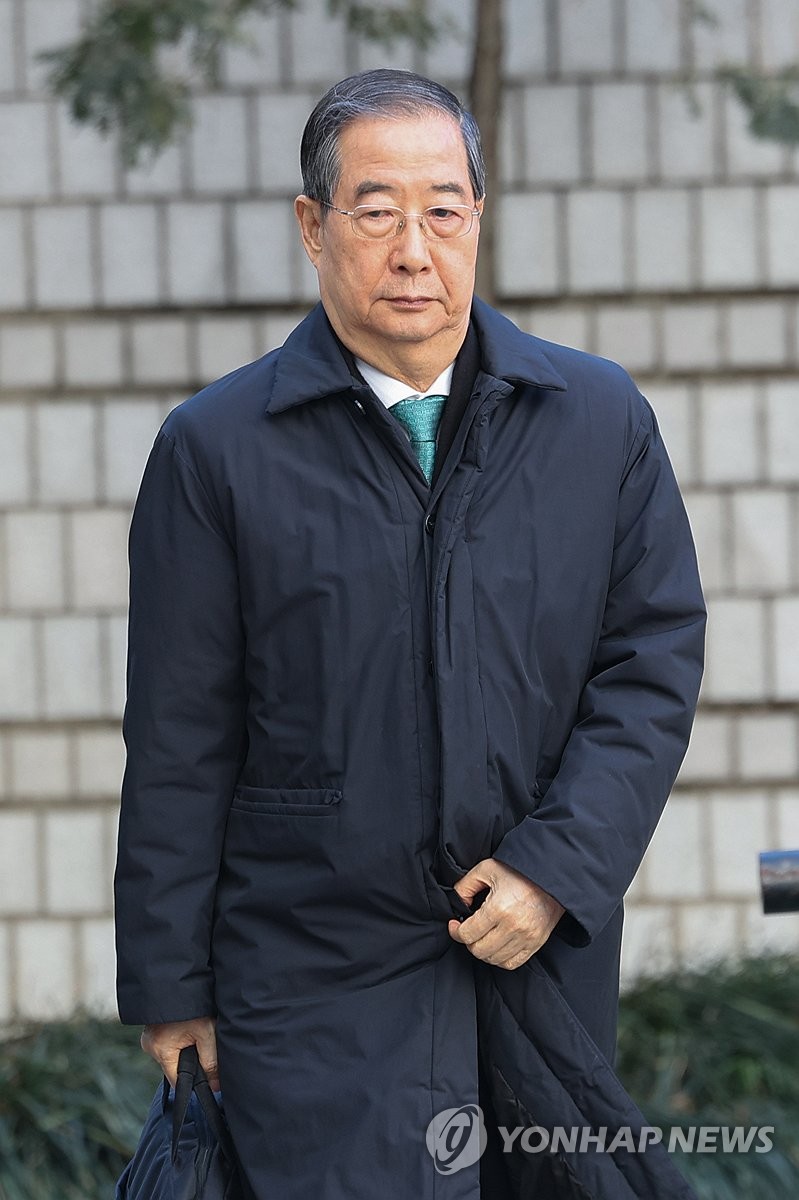 Ex-PM Han sentenced to 23 yrs in prison