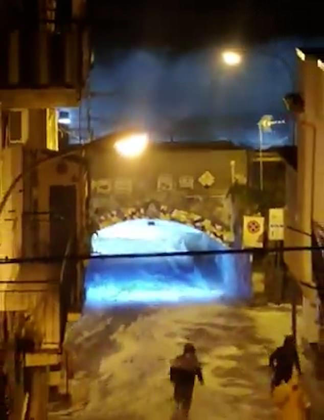 People run for their lives from tsunami-style storm surge which engulfs ...