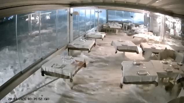 Storm surge floods dining room of Italian seafront restaurant