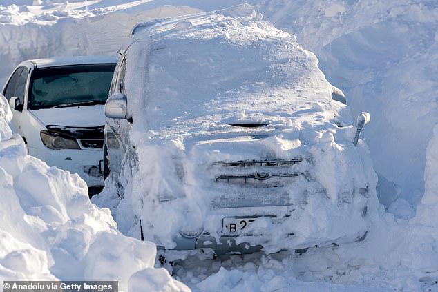 Extreme snowfall buries towns in Far East Russia after worst blizzards ...