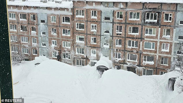 Extreme snowfall buries towns in Far East Russia after worst blizzards ...