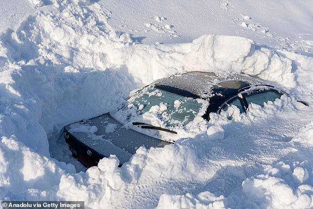 Extreme snowfall buries towns in Far East Russia after worst blizzards ...