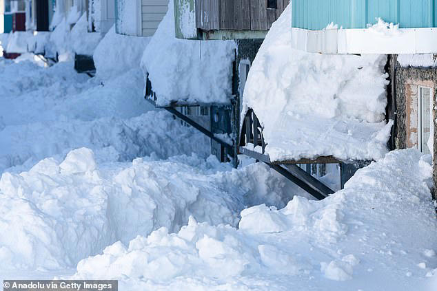 Extreme snowfall buries towns in Far East Russia after worst blizzards ...
