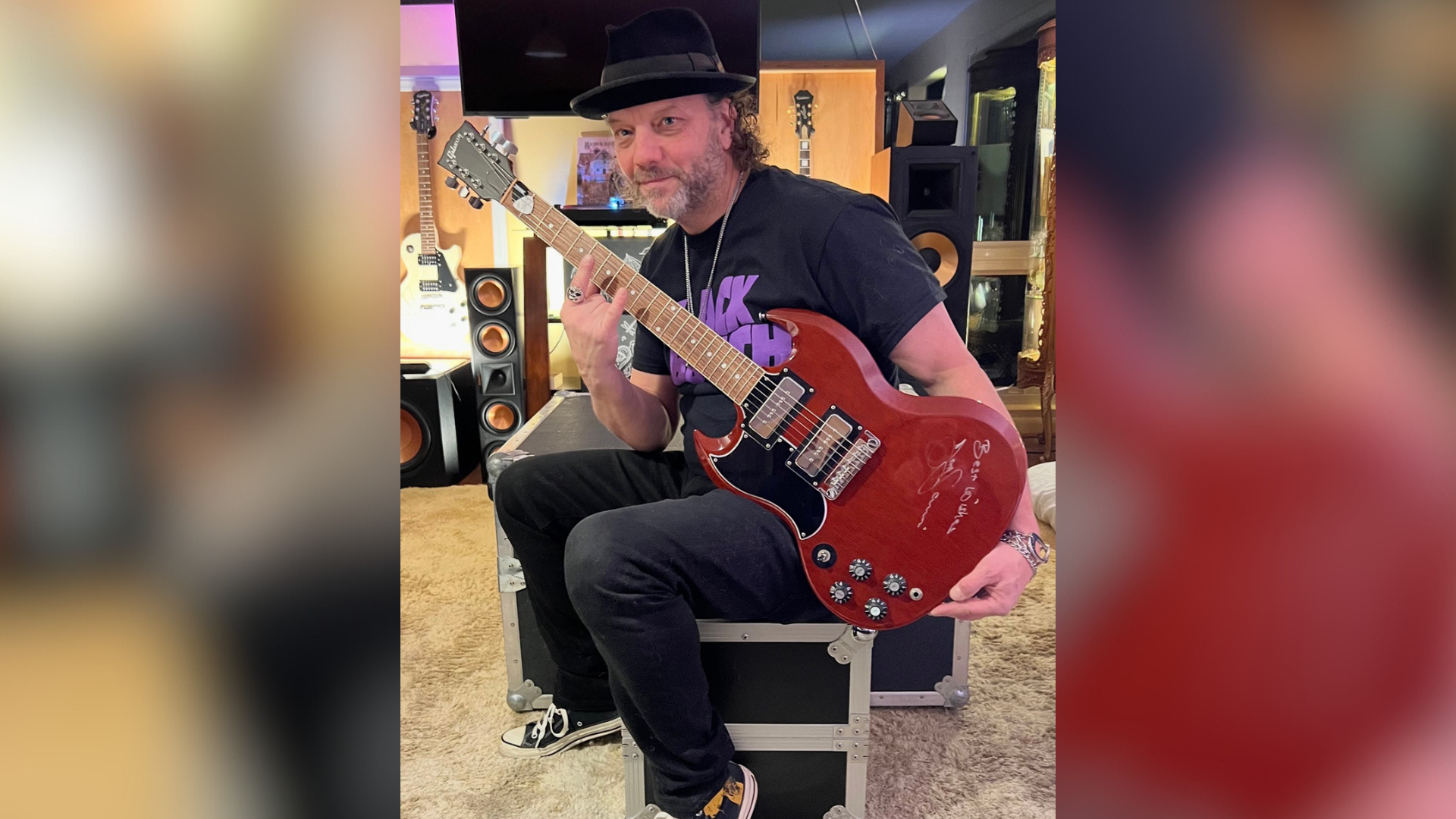 Rock legend raises £53k for cancer unit
