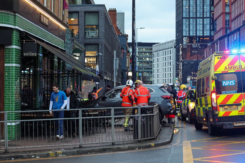 Emergency services rush to city centre street after car almost ploughs ...