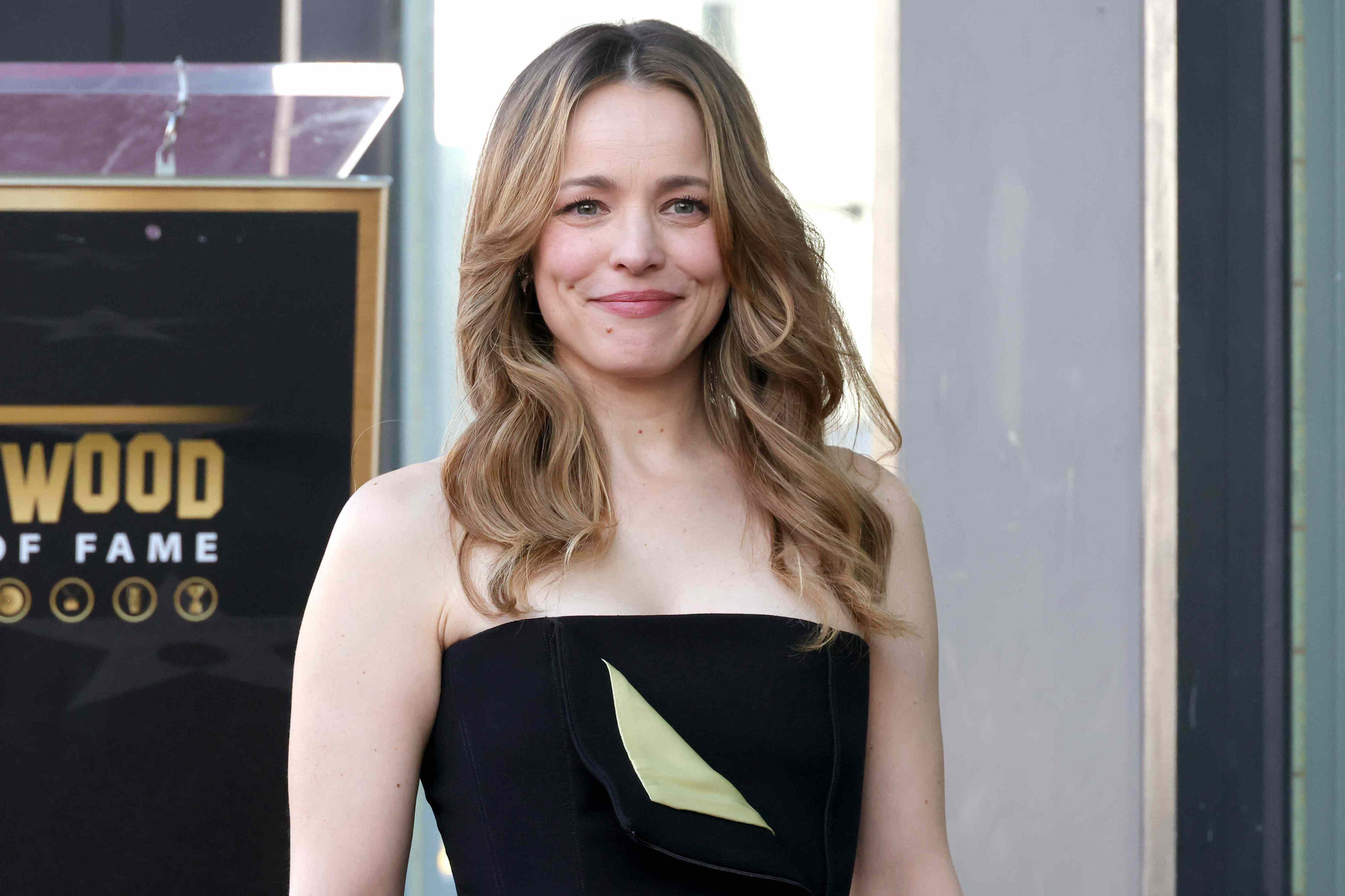 Rachel McAdams stuns in an ultra plunging, button-up bodycon dress ...