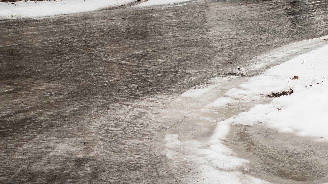 Slightly warmer as snow showers return through Wednesday