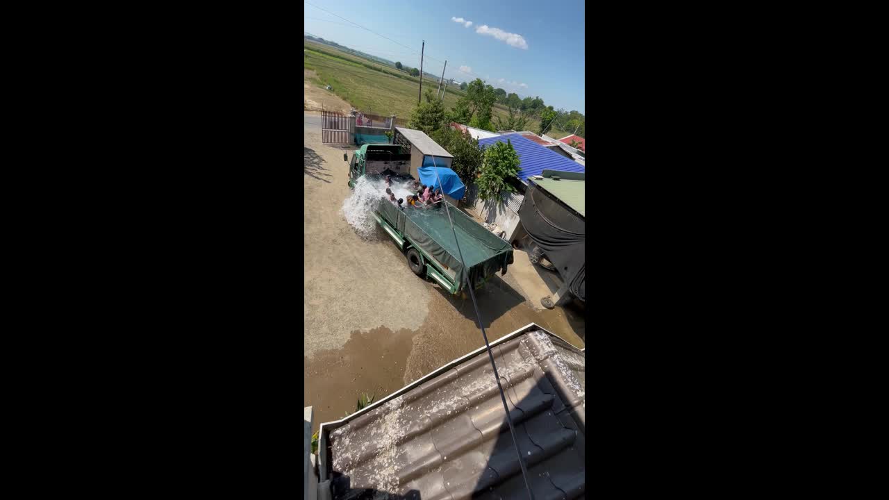 Locals cool off with makeshift wave pool in the back of truck