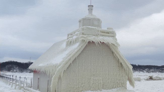 Thick ice coats Michigan lighthouse ahead of Arctic front