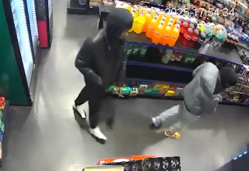 Watch: Suspects rob victim at gunpoint inside Atlanta store
