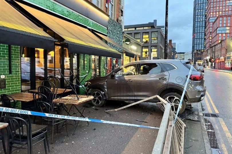 Car almost ploughs into city centre bar in dramatic crash