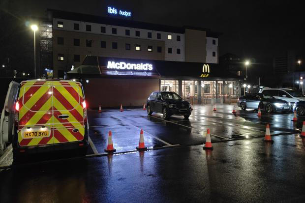 Police cordon off car at McDonald's car park