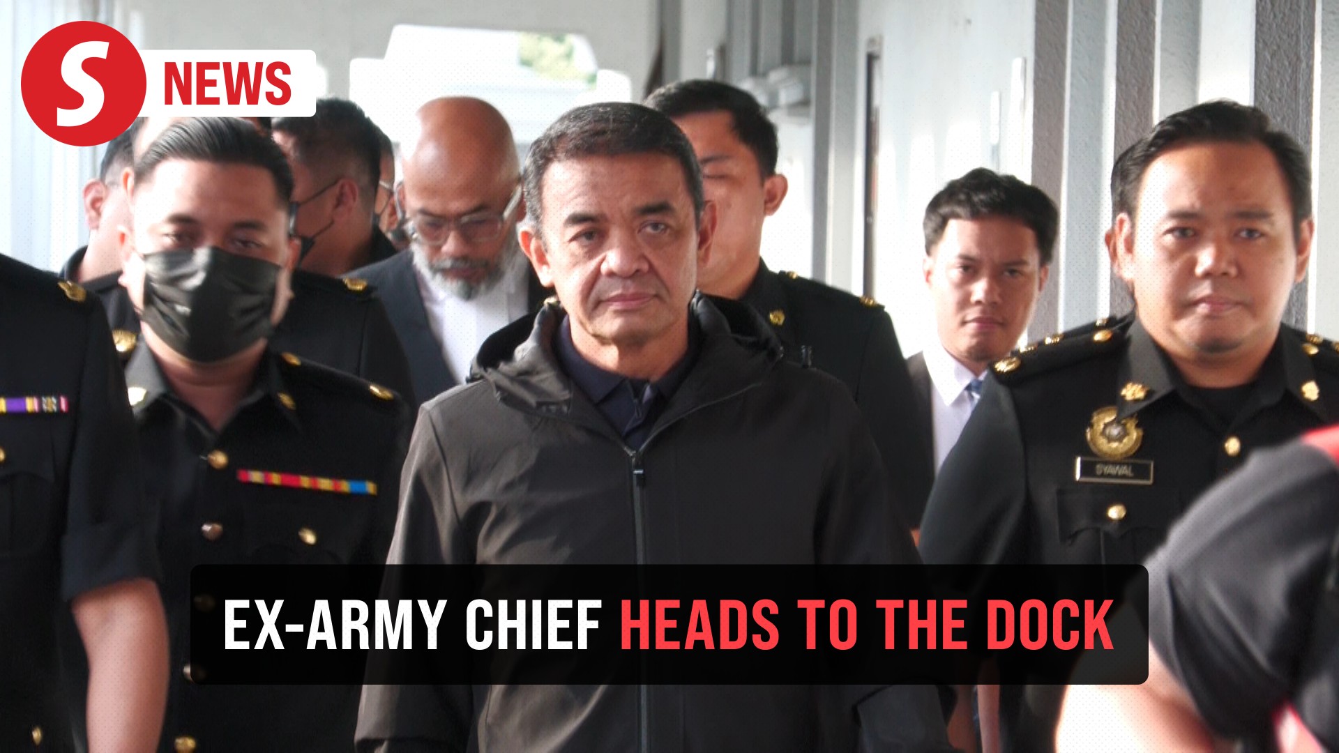 Ex-army chief arrives at court to face money laundering charges