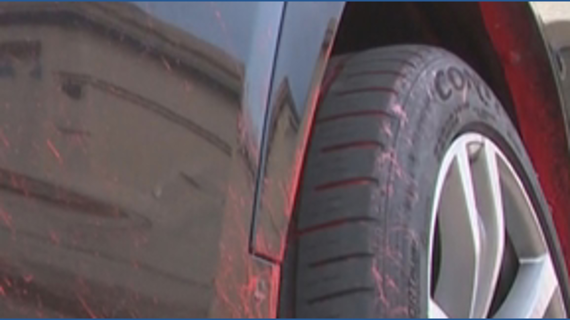 Car damaged by wet, red paint on Loop 202