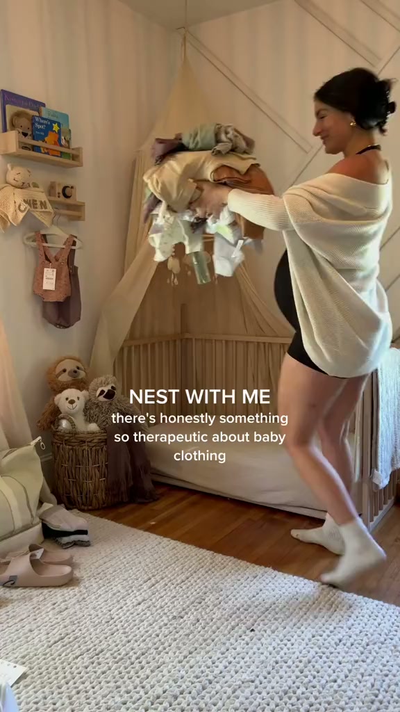 Nesting before baby organizing tiny clothes to stay sane