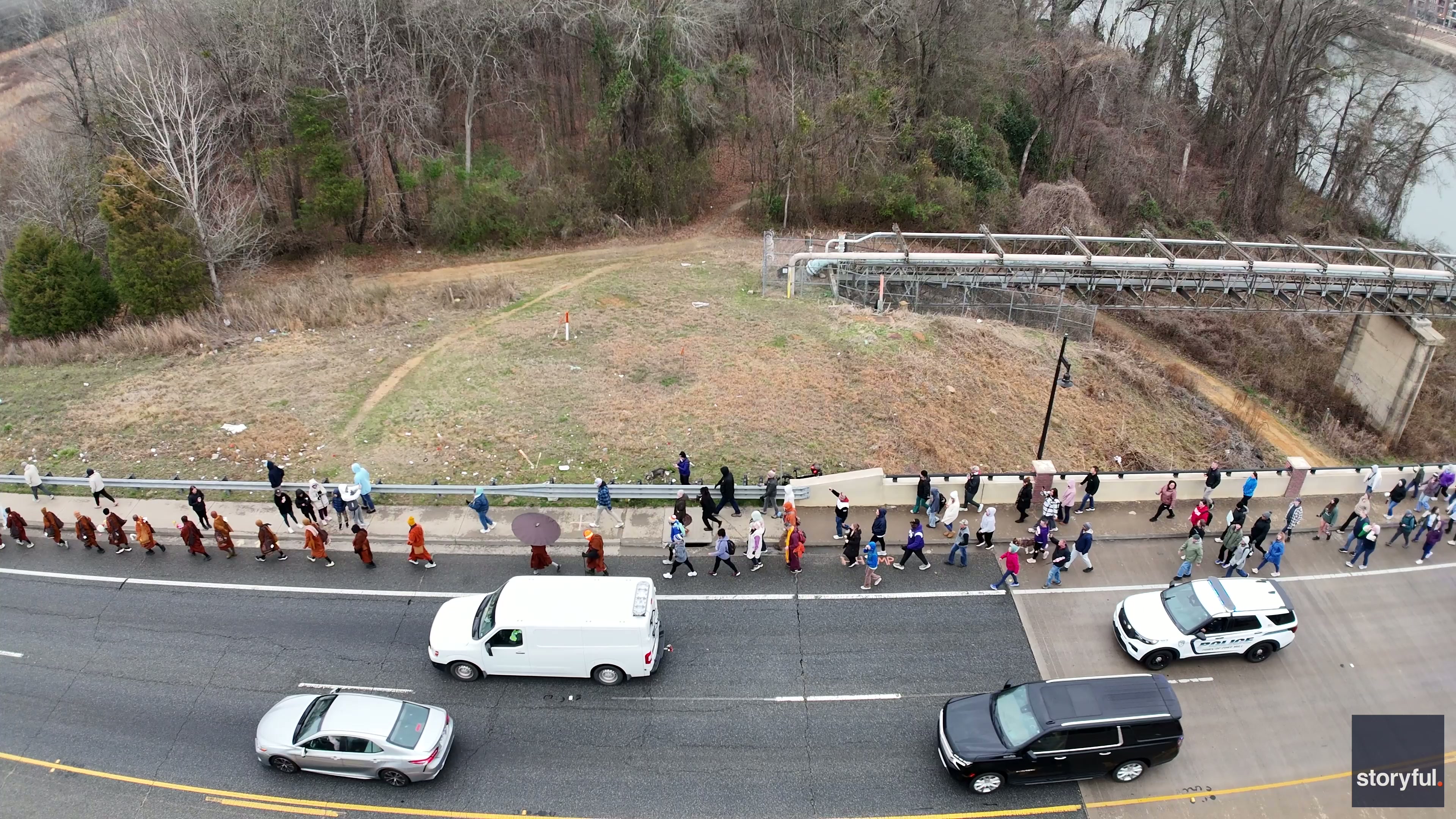 Drone footage captures monks' peace walk through Charlotte suburb