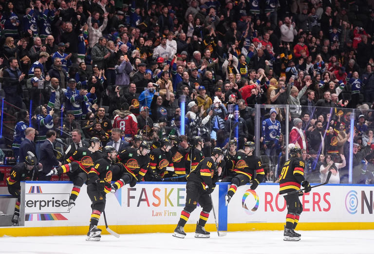 Canucks rally from two-goal deficit to beat Capitals, snap 11-game ...