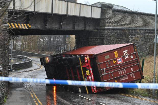 Person trapped in overturned lorry on Bradford district road