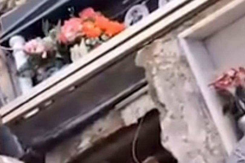 Coffins left scattered after huge landslide as monster floods smash Europe