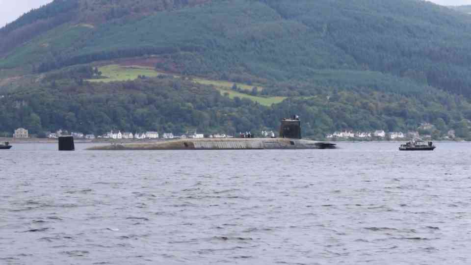 After months at sea - a Vanguard submarine returns home