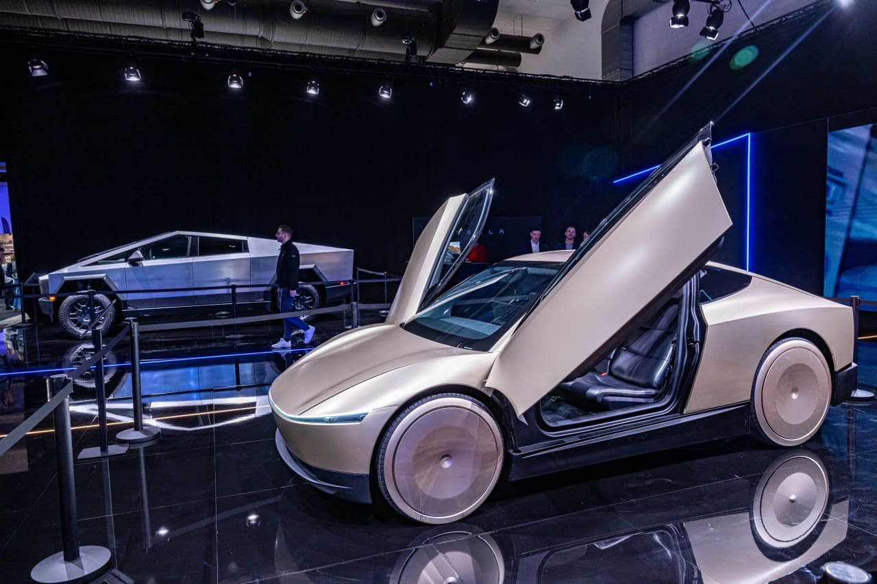 Tesla stock rises. Musk manages cybercab hopes as robo-taxi drive ...