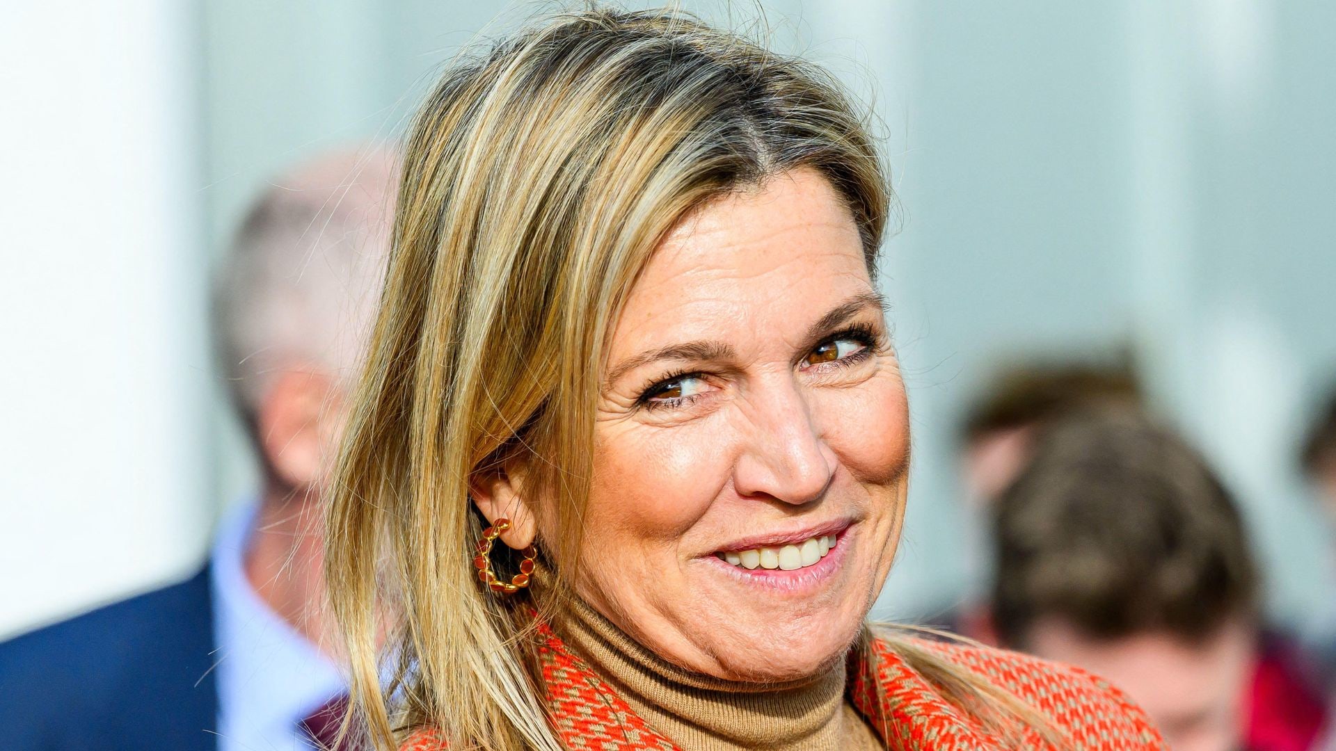 Queen Maxima is a 'burst of cheer' in waist-cinching orange look and ...
