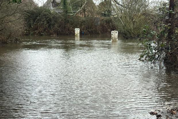 Fire crews rush to incident as car stuck in flood water
