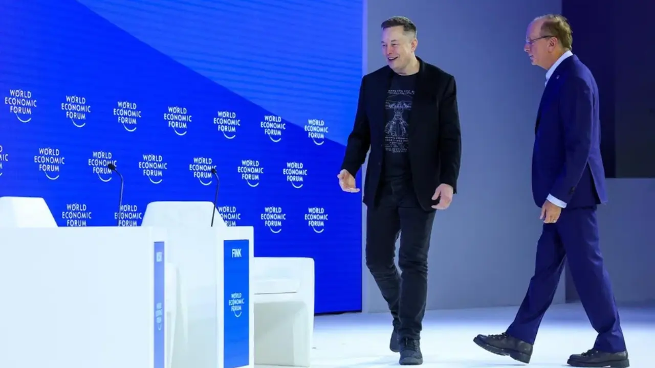 Elon Musk makes surprise Davos debut in conversation with Larry Fink at ...