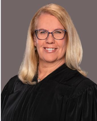 Former judge pleads guilty to stalking charge