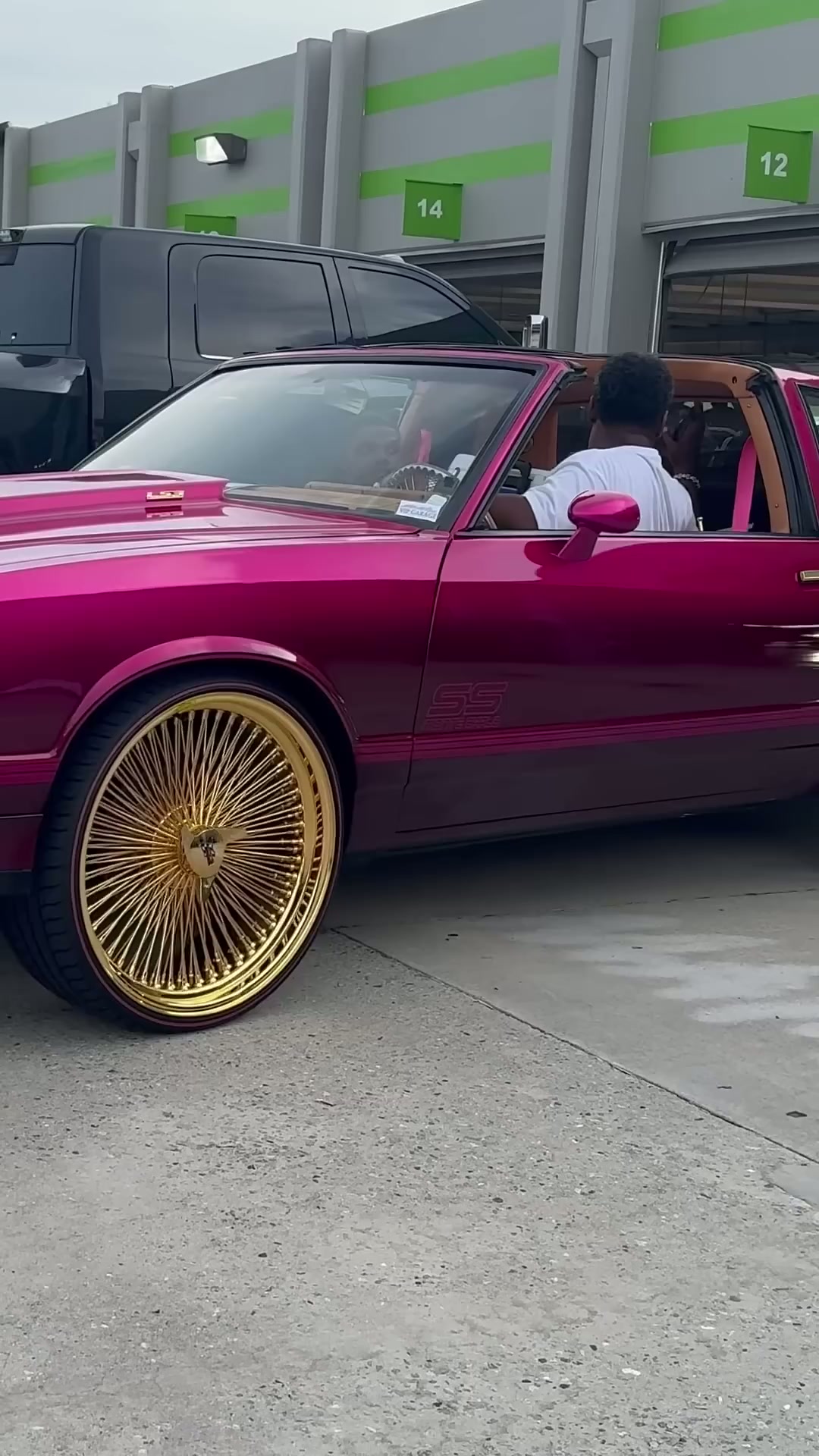 Candy Magenta Chevy MC and Oldsmobile Cutlass on Gold 24’s Daytons