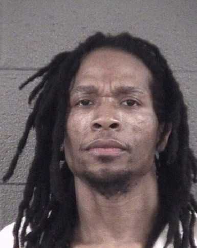 Man arrested on federal warrant, faces gun and drug charges