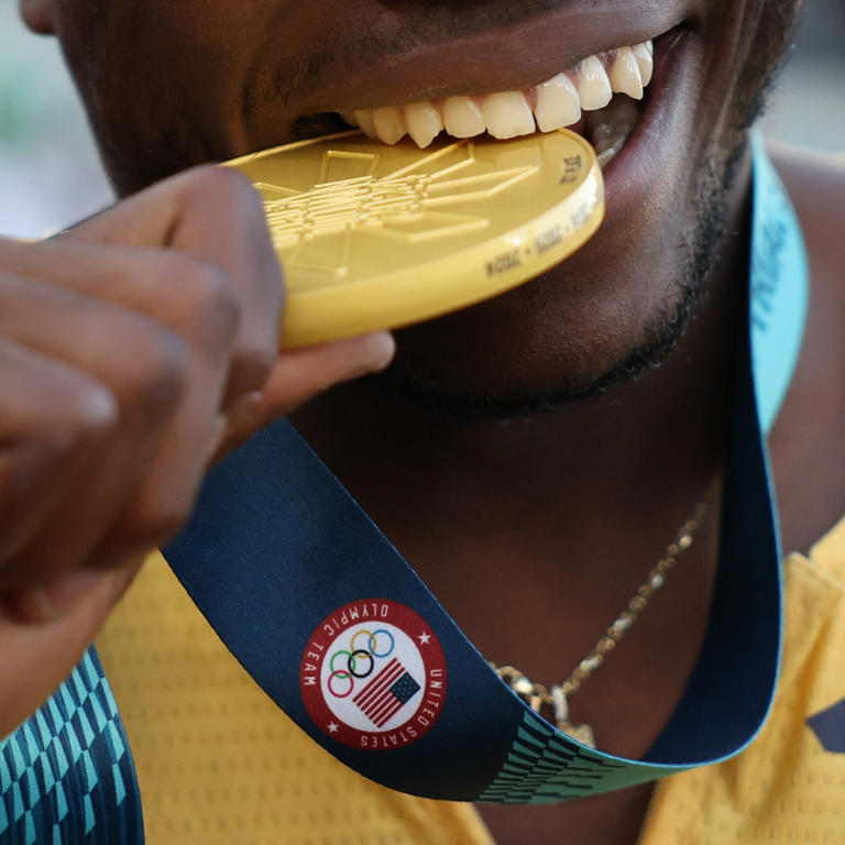 Here’s why Olympic athletes bite their medals—and how this quirky ...