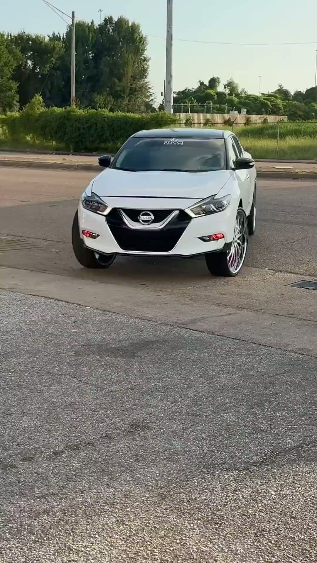White Nissan Maxima on 28’s Rucci riding
