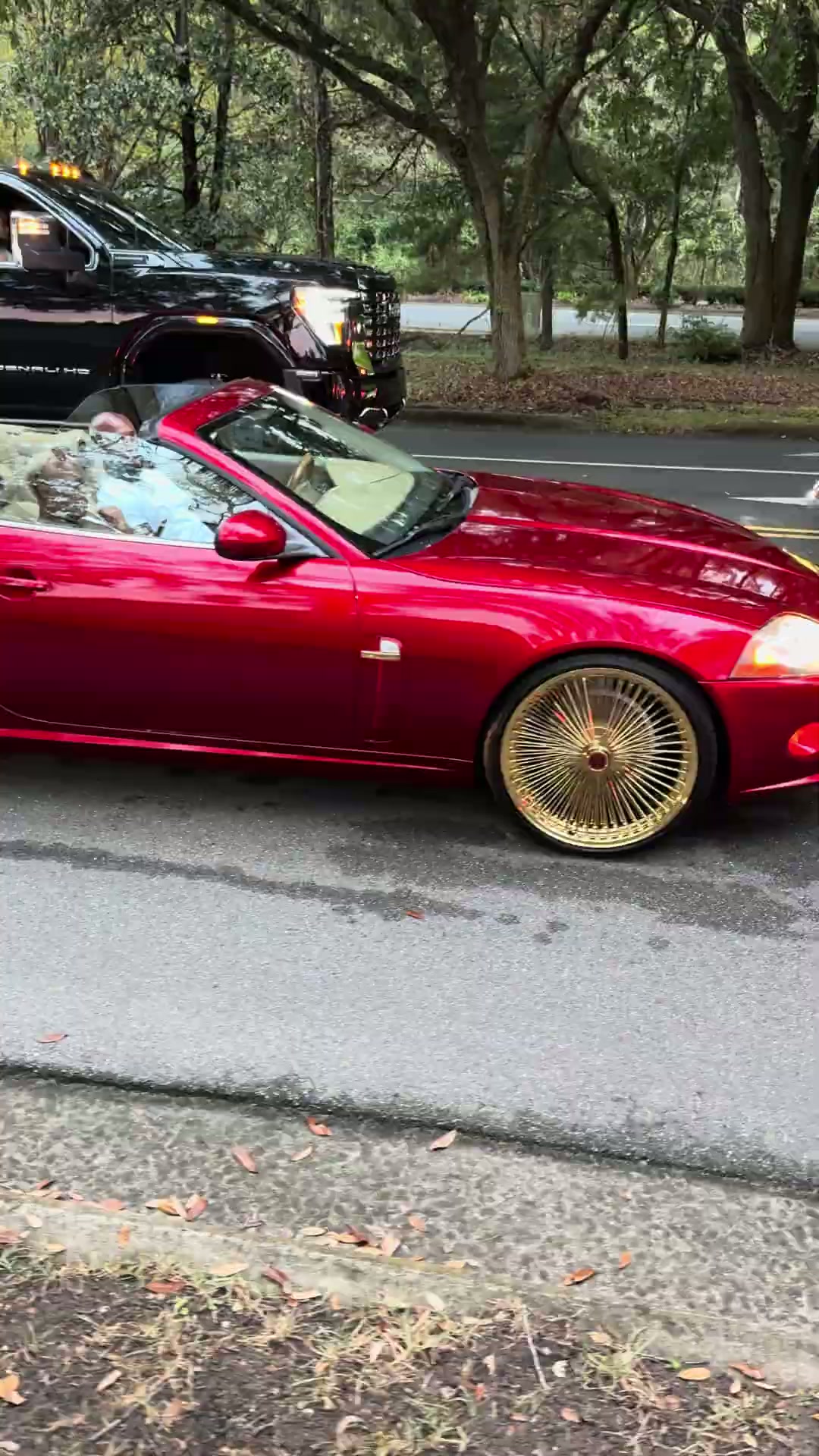 Candy red Jaguar on gold 24’s wire wheels