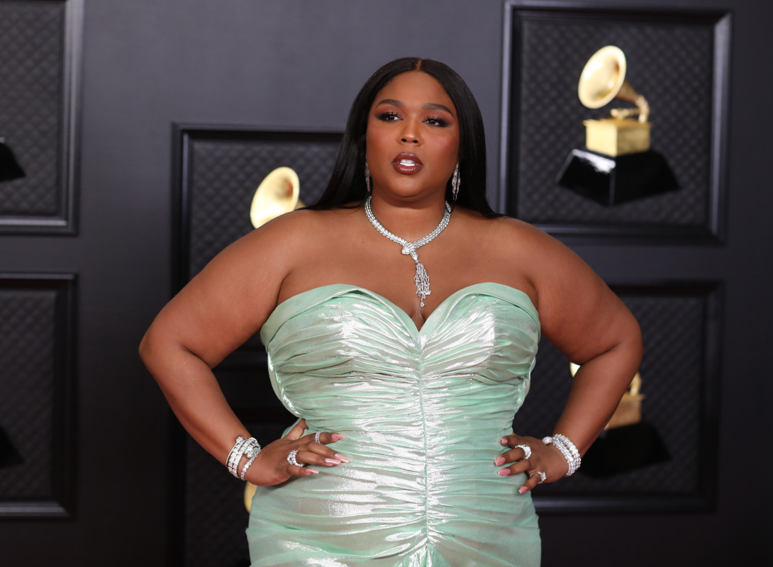 Lizzo stuns in pink mini dress after losing 16% body fat at documentary ...