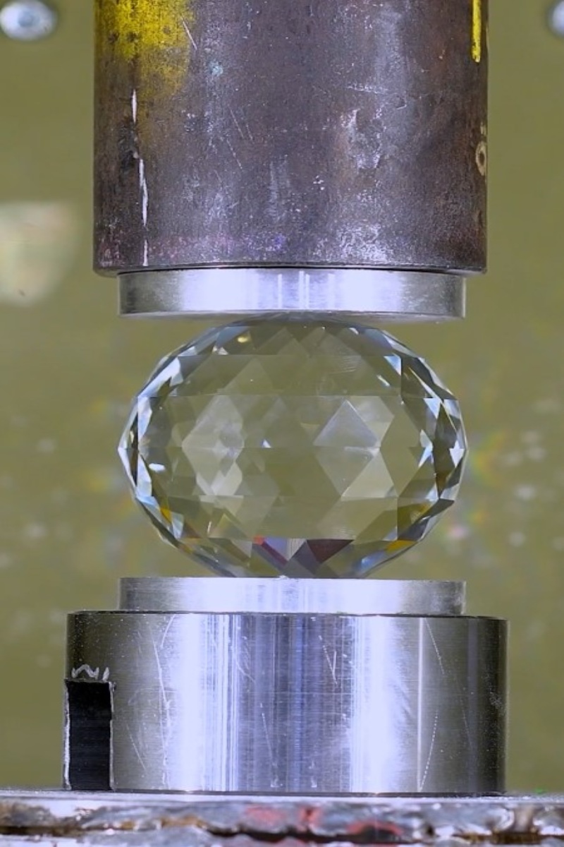 Crystal ball under hydraulic press