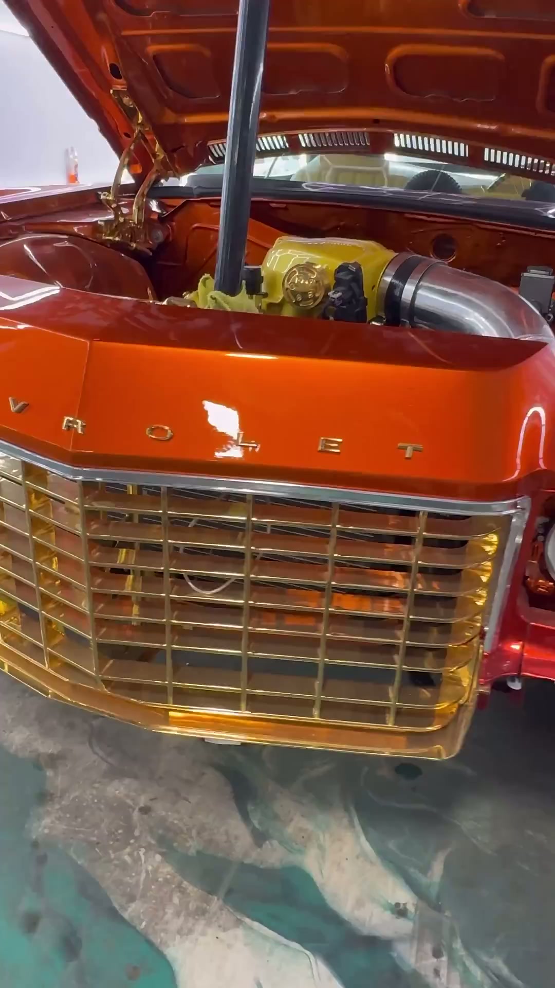 Candy orange 71 Chevy vert on gold 24’s Daytons in the lab at Magic ...