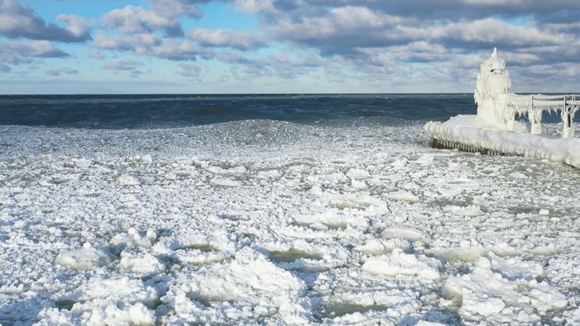 Ice pancakes roll over waves on Lake Michigan