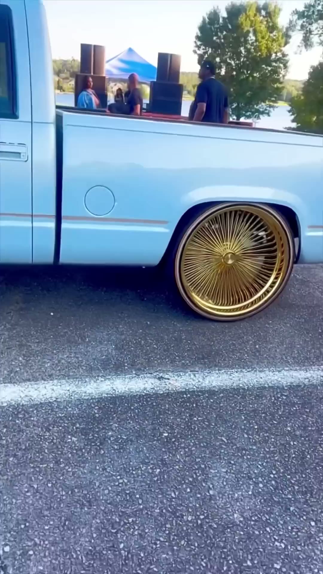 White GMC 1600 truck on gold 26’s wire wheels