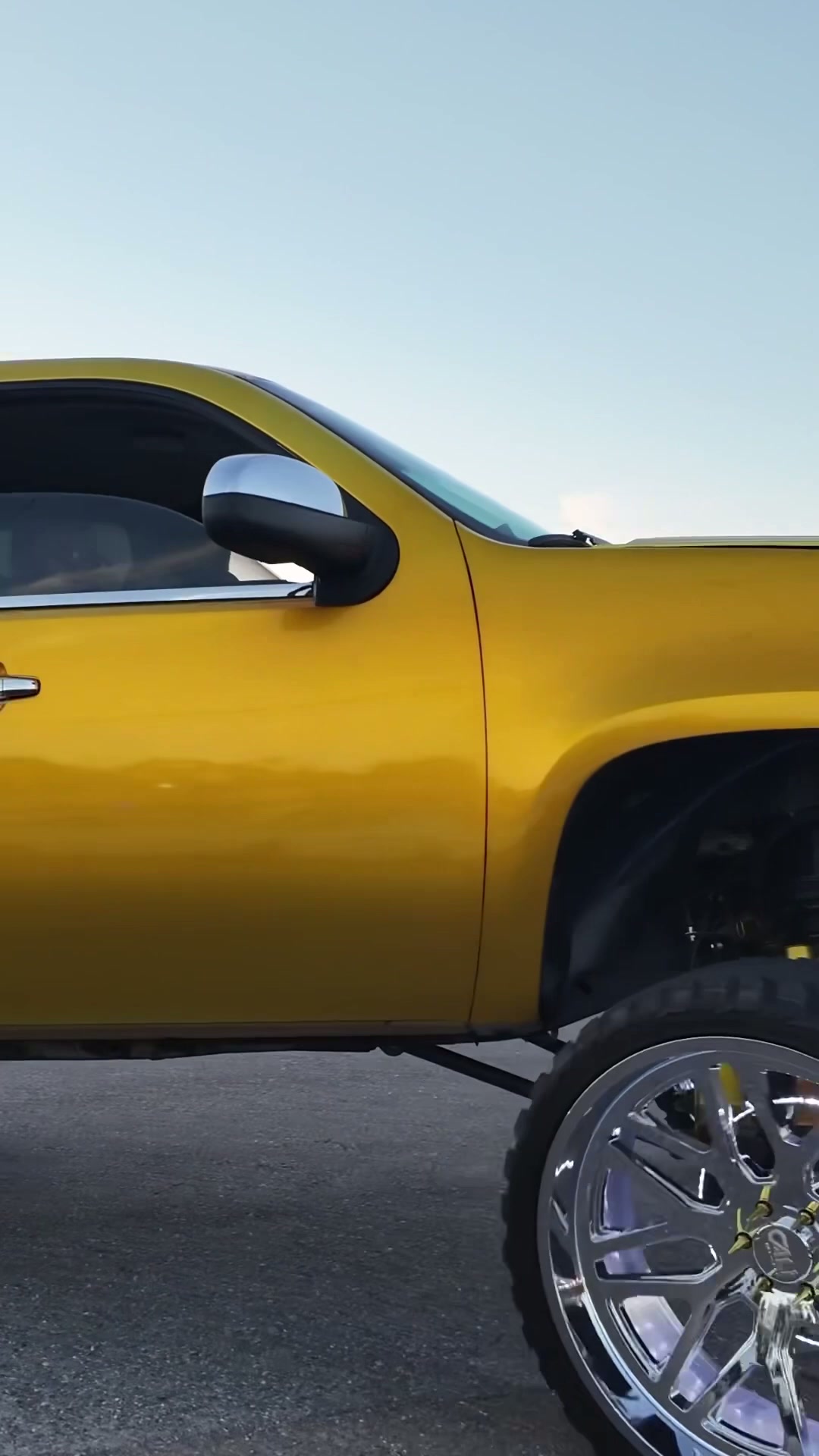 Candy gold lifted Chevy Tahoe on off-road 28’s